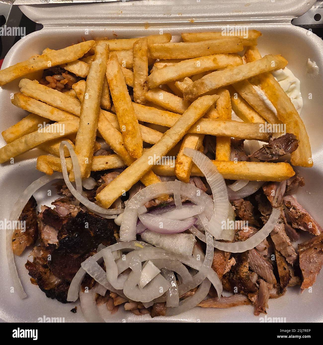 Enjoy a delicious and mouthwatering platter that features crispy fries ...