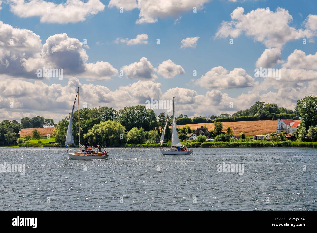 Sailboats sailing on Alssund Strait along the coast of Jutland towards ...