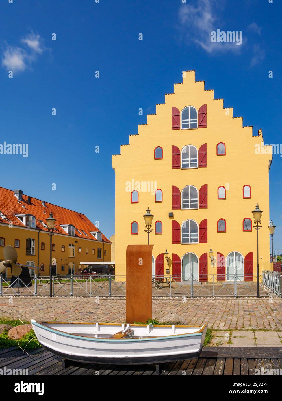 Historic yellow granary warehouse along Svendborg Museum Harbour, Funen ...