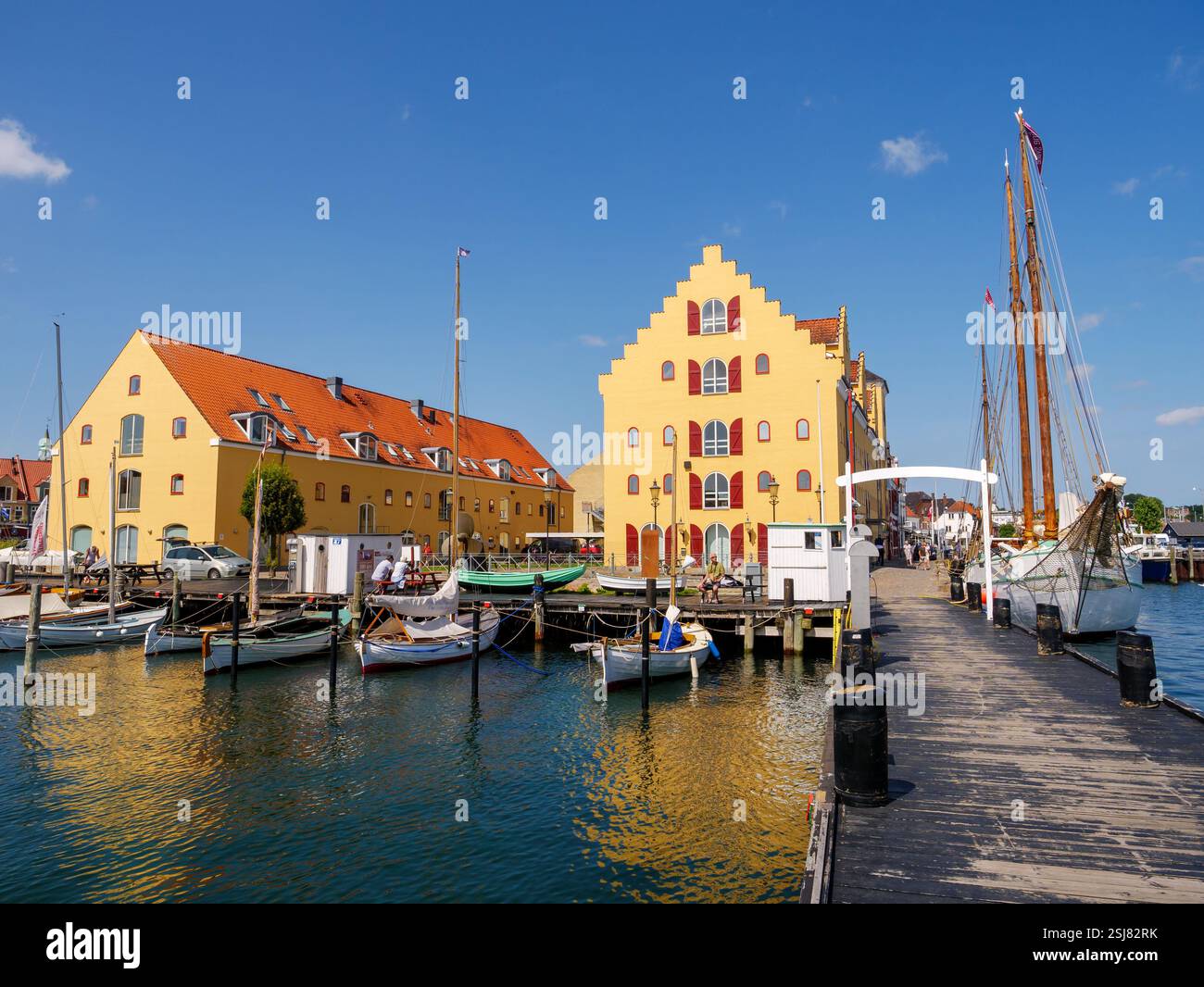 Svendborg Museum Harbour with colorful yellow waterfront granary ...