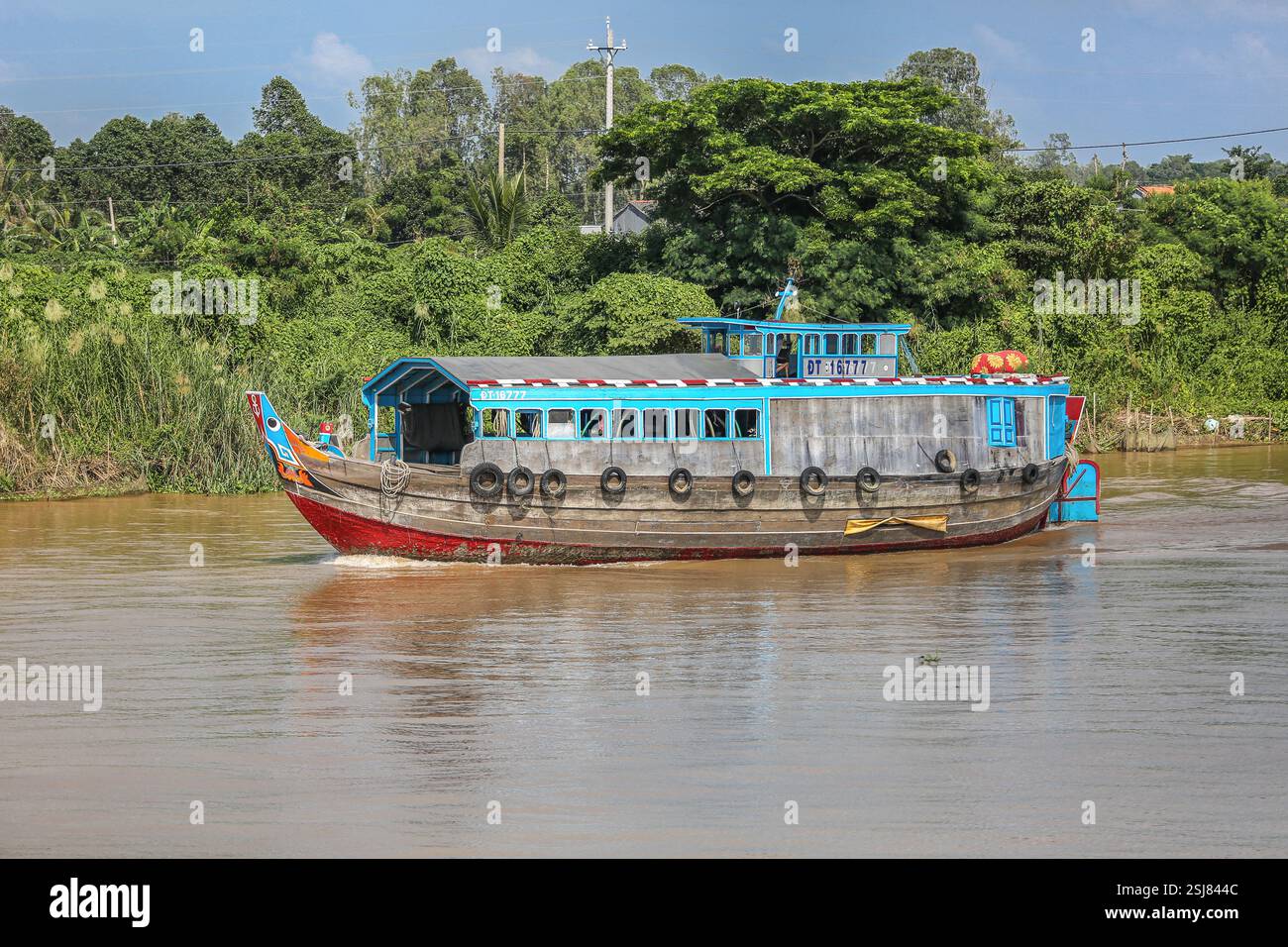 Traditional Mekong Delta freight painted wooden cargo boat, Vietnam ...
