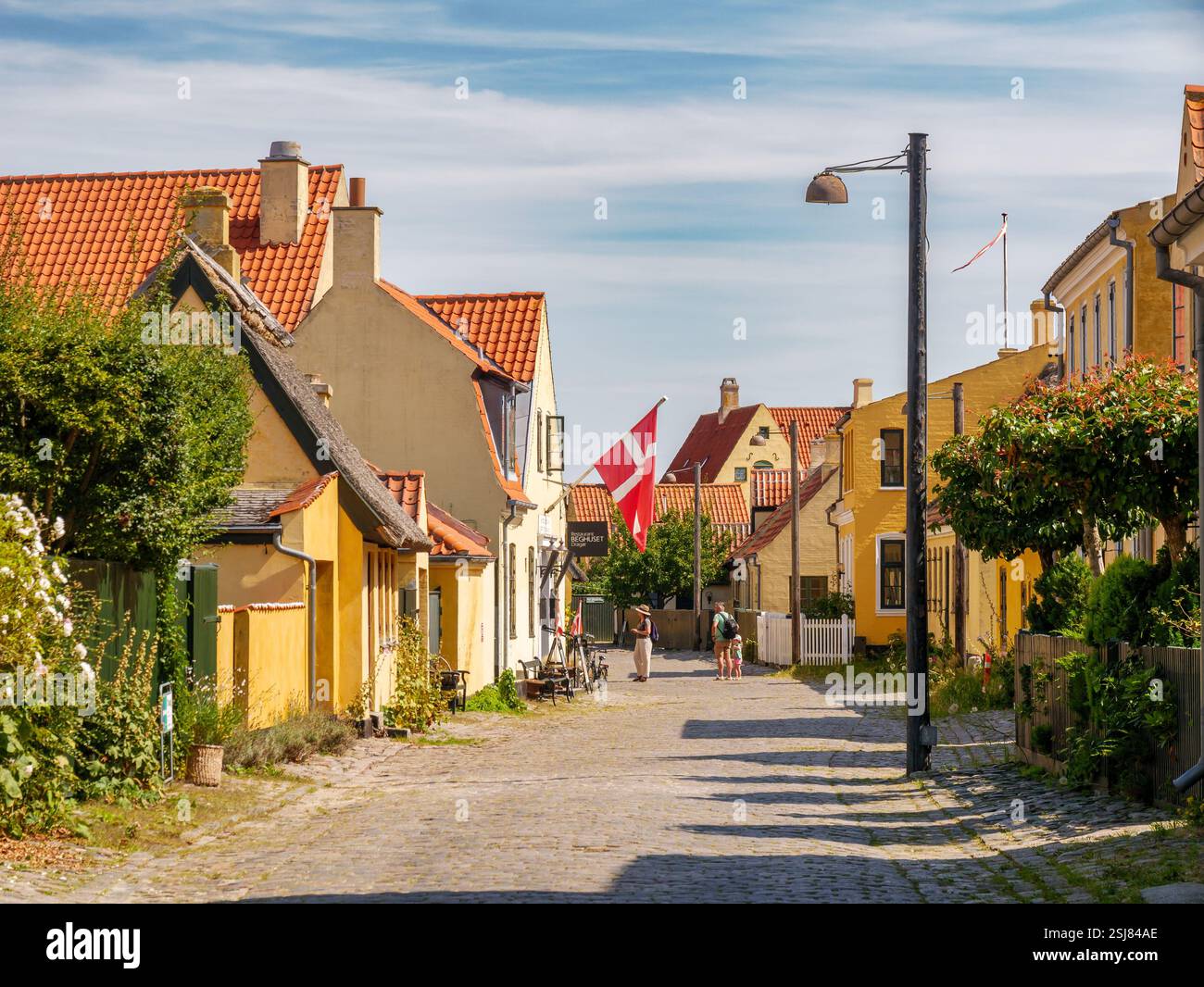 Dragør Old Town with people walking in cobblestone street Strandgade ...