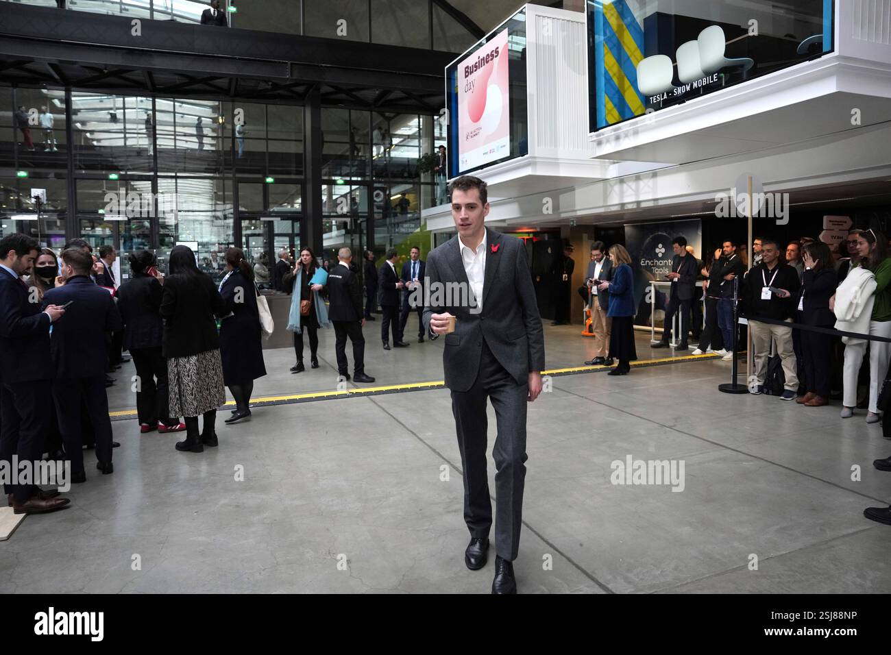 Arthur Mensch, CEO of Mistral AI, carries a cup at Station F, during an ...
