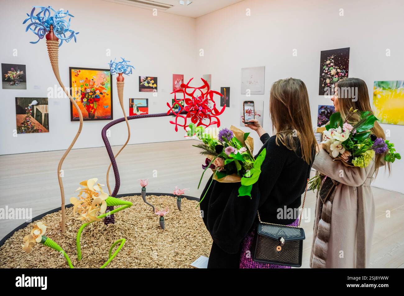 London, UK. 11th Feb, 2025. Visitors, who have been given bunches of ...