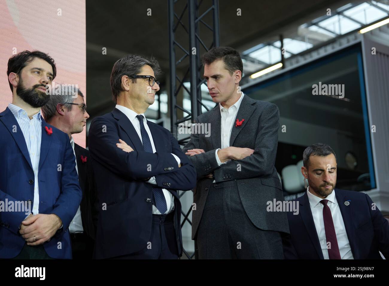 Arthur Mensch, CEO of Mistral AI, right, speaks with Nicolas Dufourcq ...