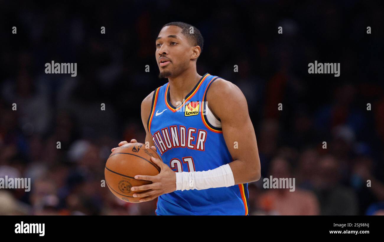 Oklahoma City Thunder guard Aaron Wiggins handles the ball during the first half of an NBA ...