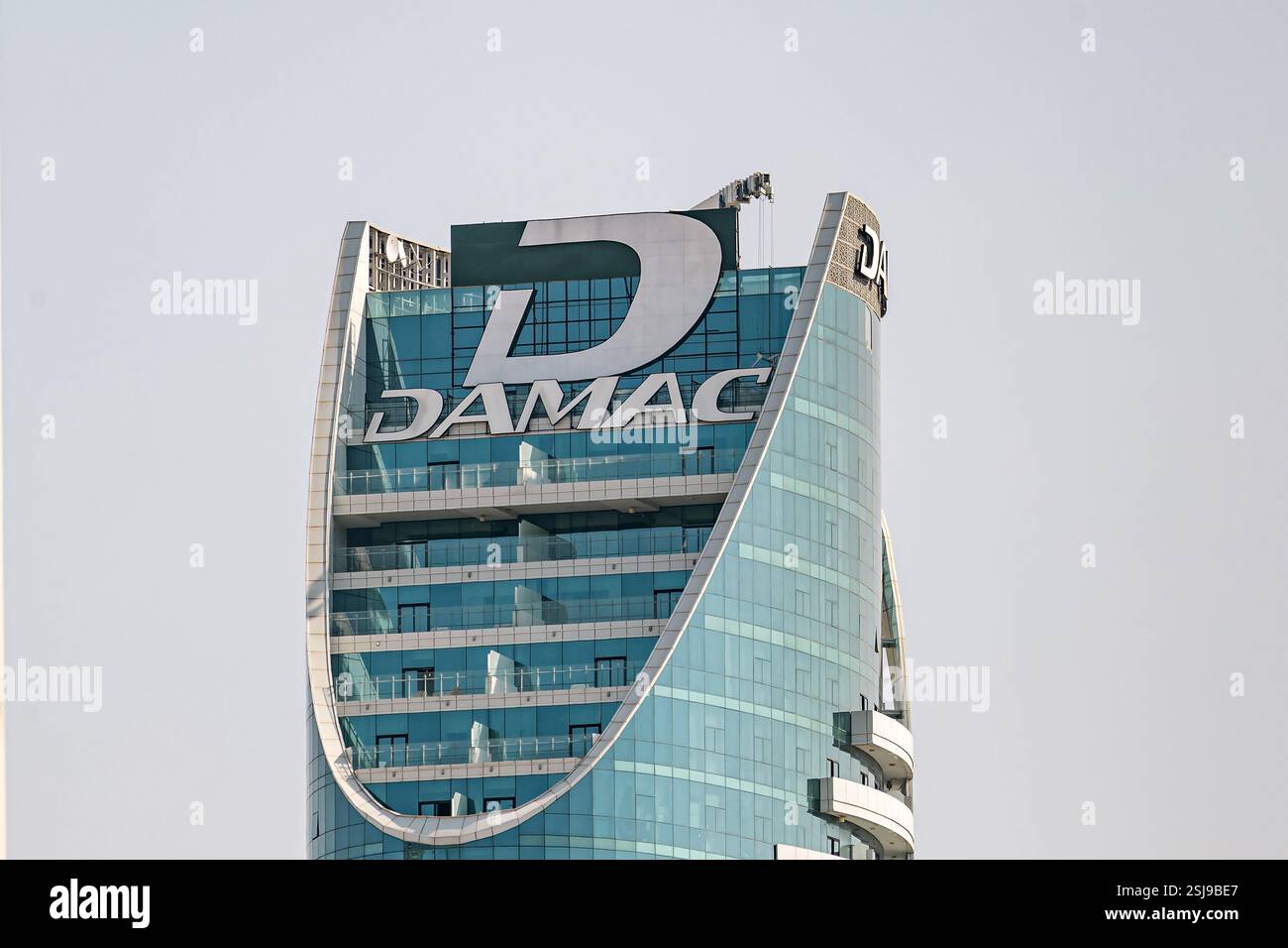 Damac development company logo on high building. DAMAC Maison ...