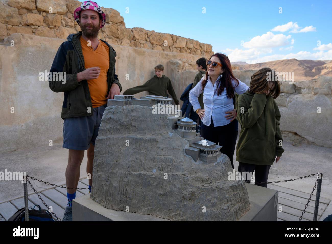 A model of Herod's palace at Masada, Israel A tour guide is using the model to explain the ...
