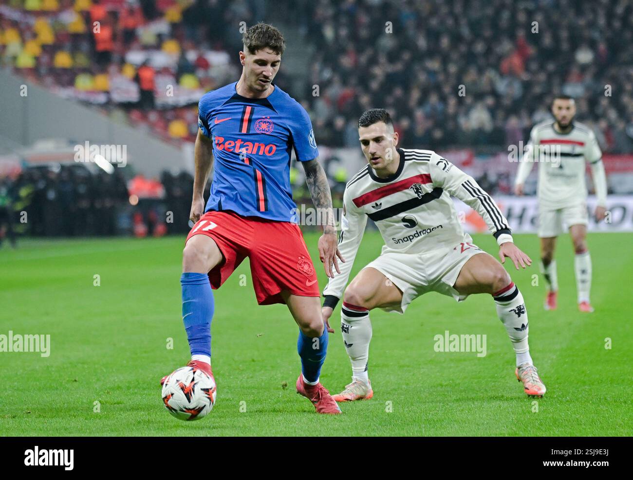 David Miculescu (FCSB) and Diogo Dalot (Man Utd) pictured during the ...