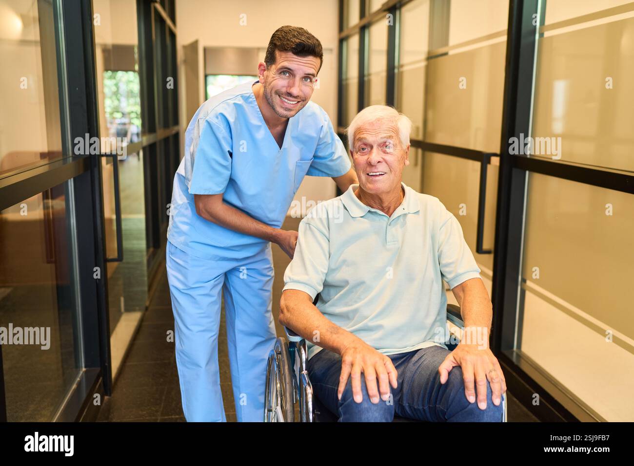 A caring healthcare professional in scrubs helps an elderly man in a ...