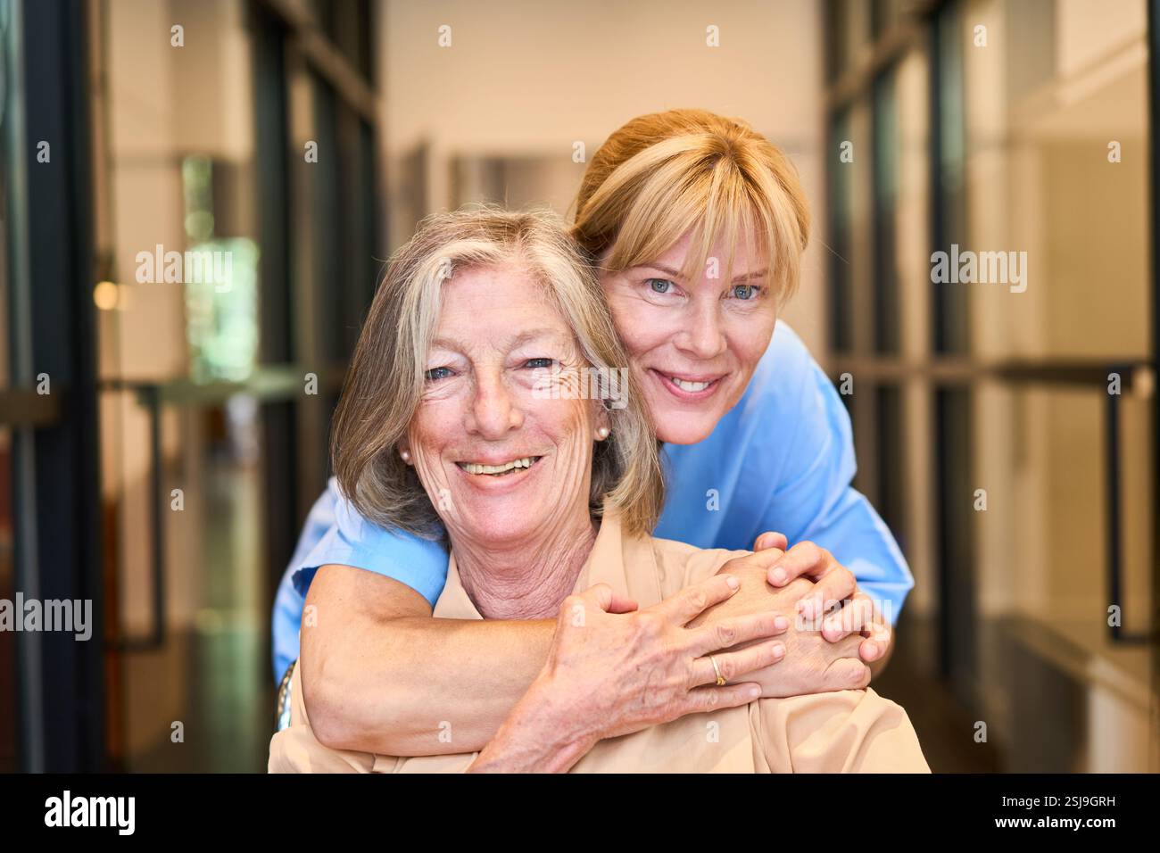 Caregiver embracing senior woman creating a warm and supportive ...
