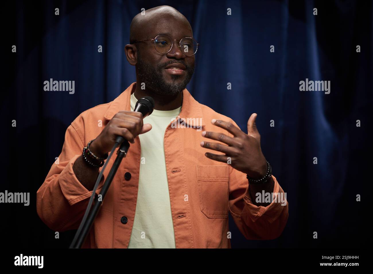 African American man giving motivational speech while holding ...