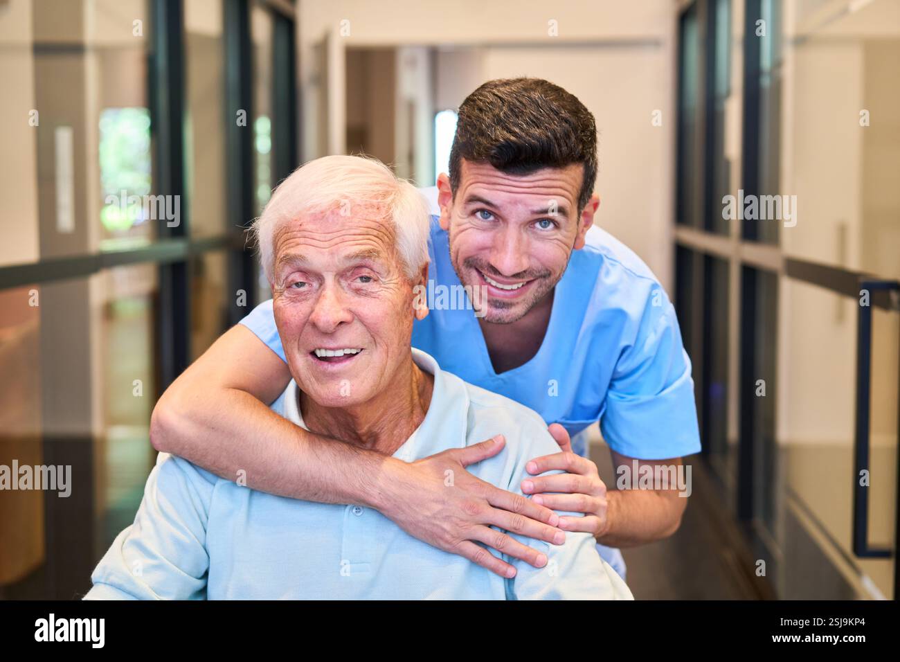 A friendly nurse and a senior man share a moment of joy in a healthcare ...