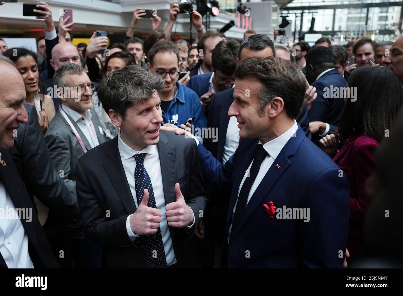 Sam Altman, CEO of OpenAI, center left, speaks with French President ...