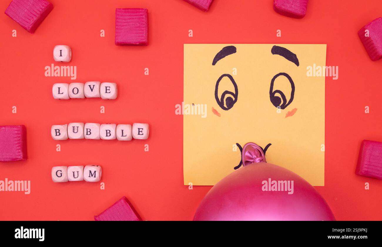 A concept of an emoticon note, blowing a bubble of bubble gum on a red ...