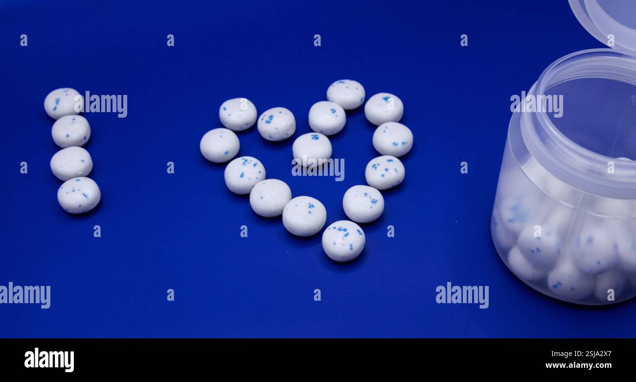 A concept of a jar of chewing gum on a blue background for National ...