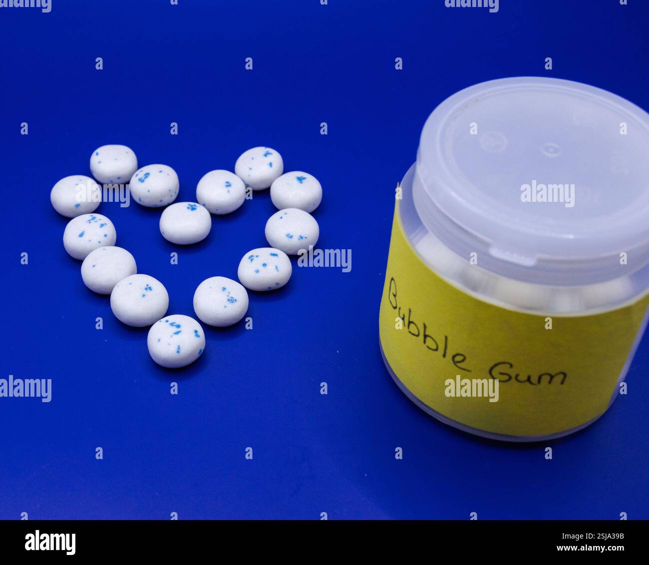 A concept of a jar of chewing gum on a blue background for National ...