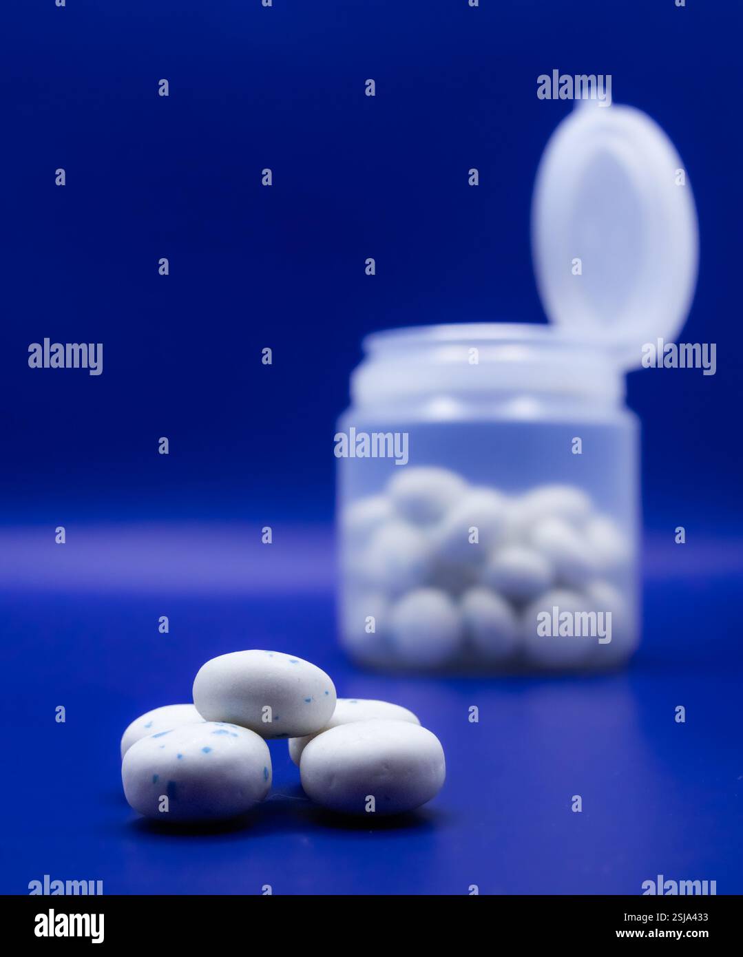 A concept of a jar of chewing gum on a blue background for National ...