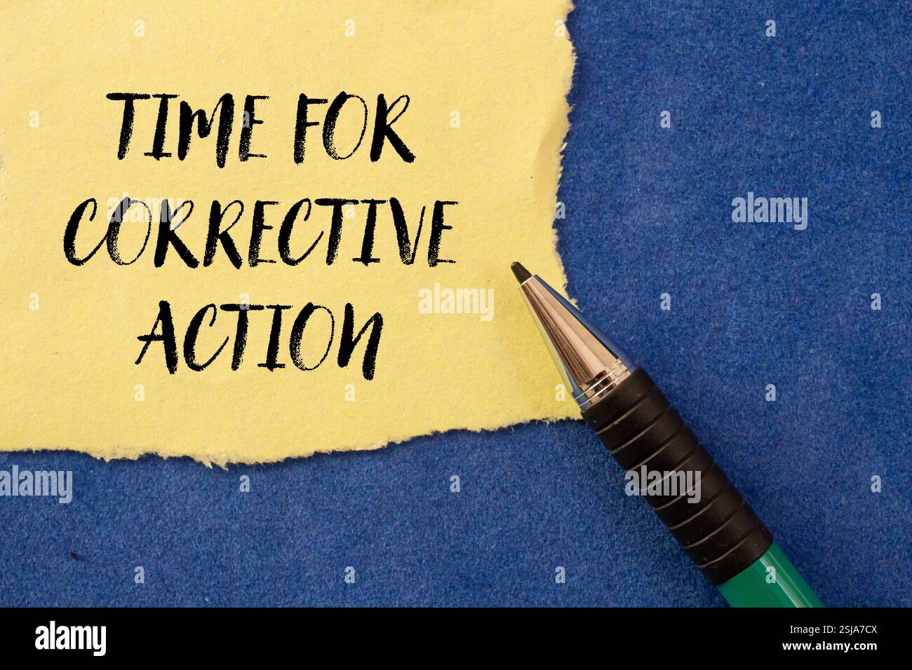 Time for corrective action message written on ripped torn yellow paper ...