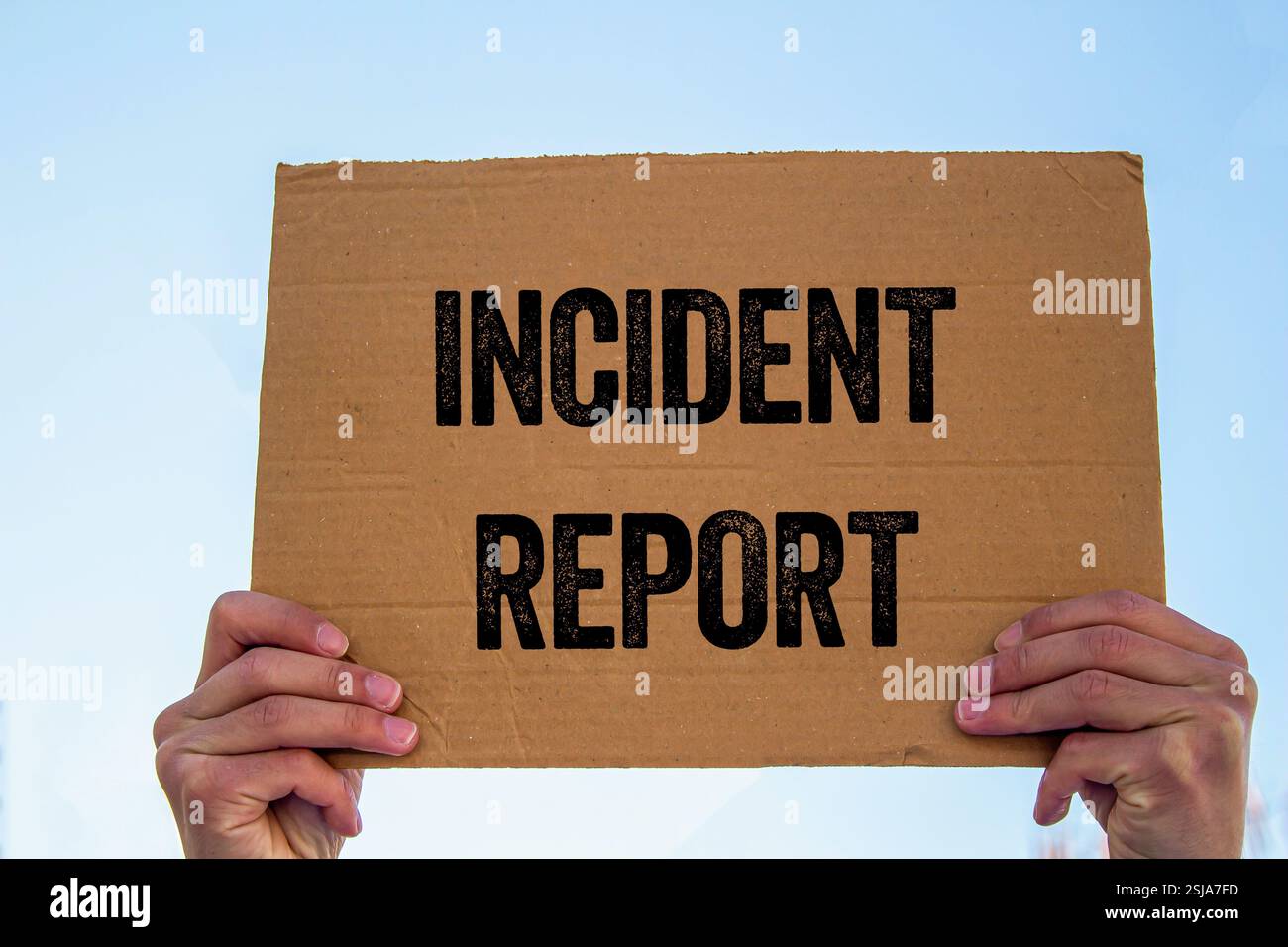 Incident report message written on cardboard sign. Conceptual incident ...