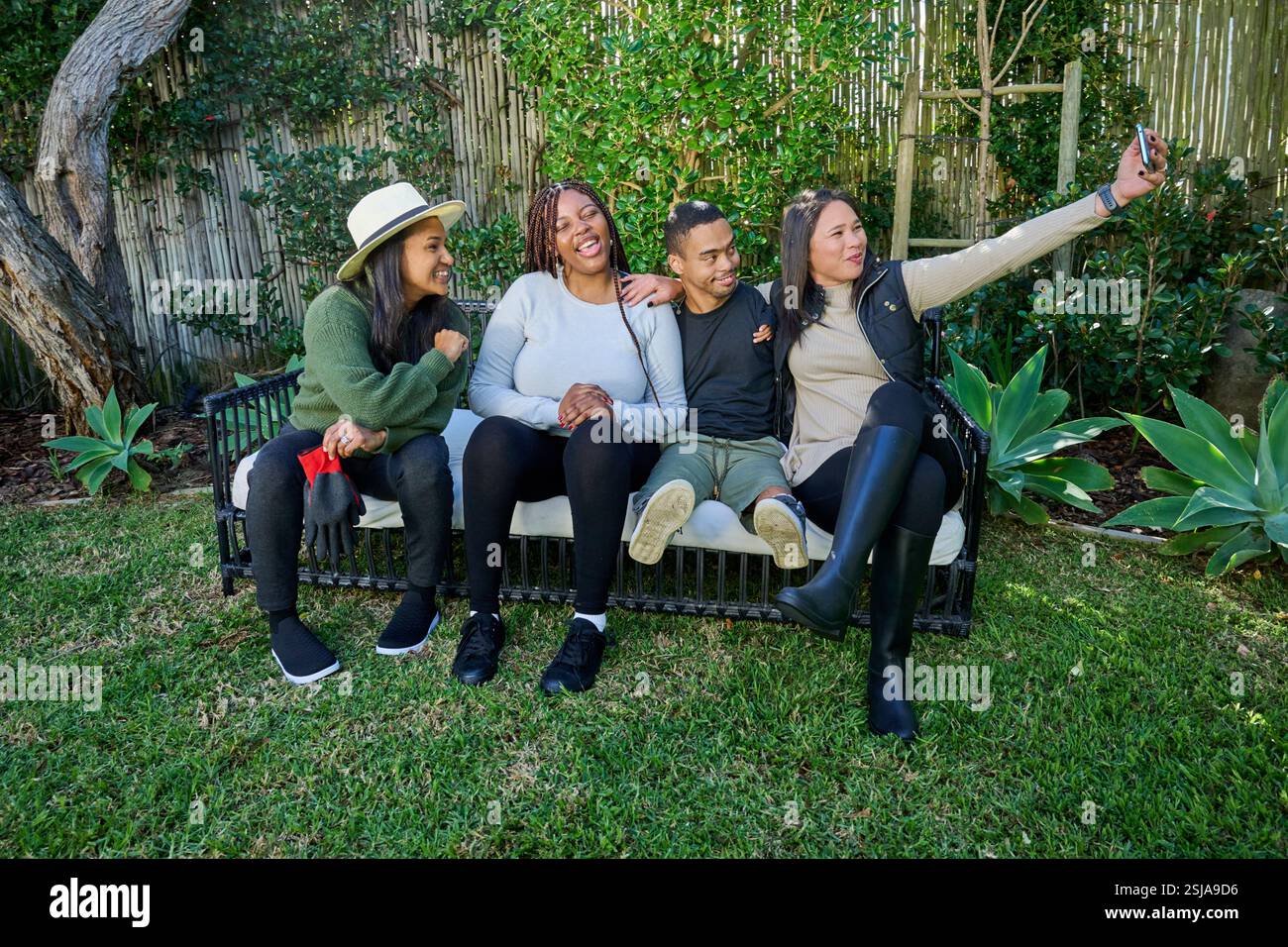 Multiracial group friends on bench hi-res stock photography and images ...