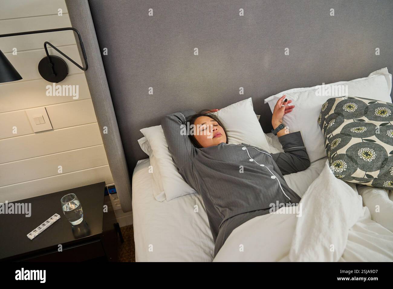 Woman sleeping in bed Stock Photo - Alamy