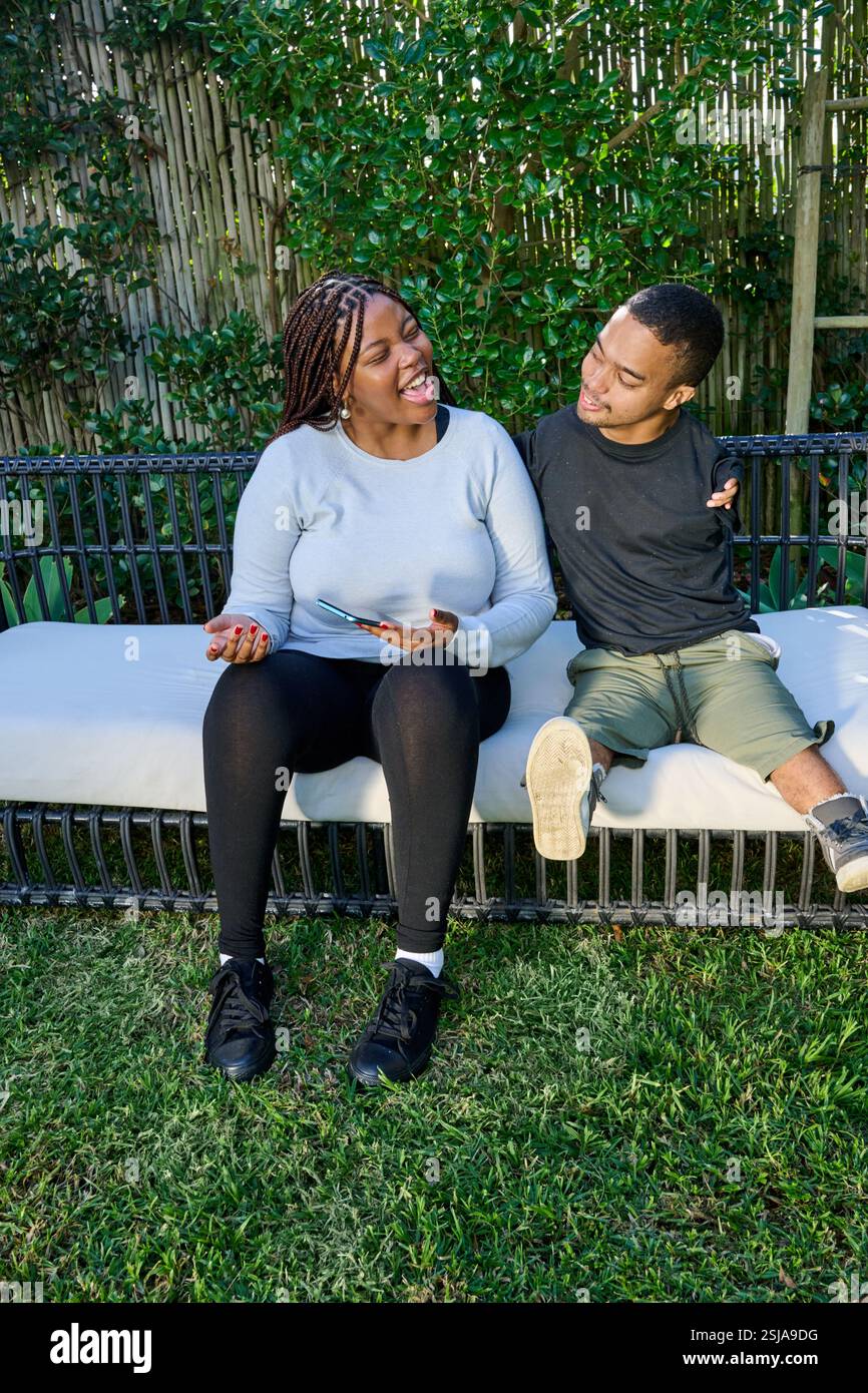 Multiracial group friends on bench hi-res stock photography and images ...