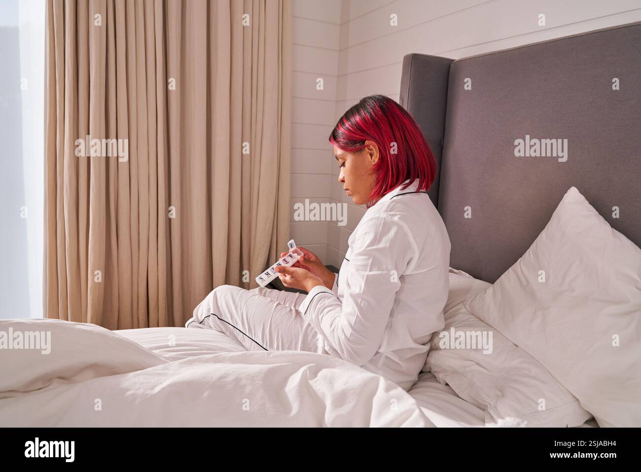 Woman with spastic diplegia cerebral palsys sitting on bead Stock Photo ...