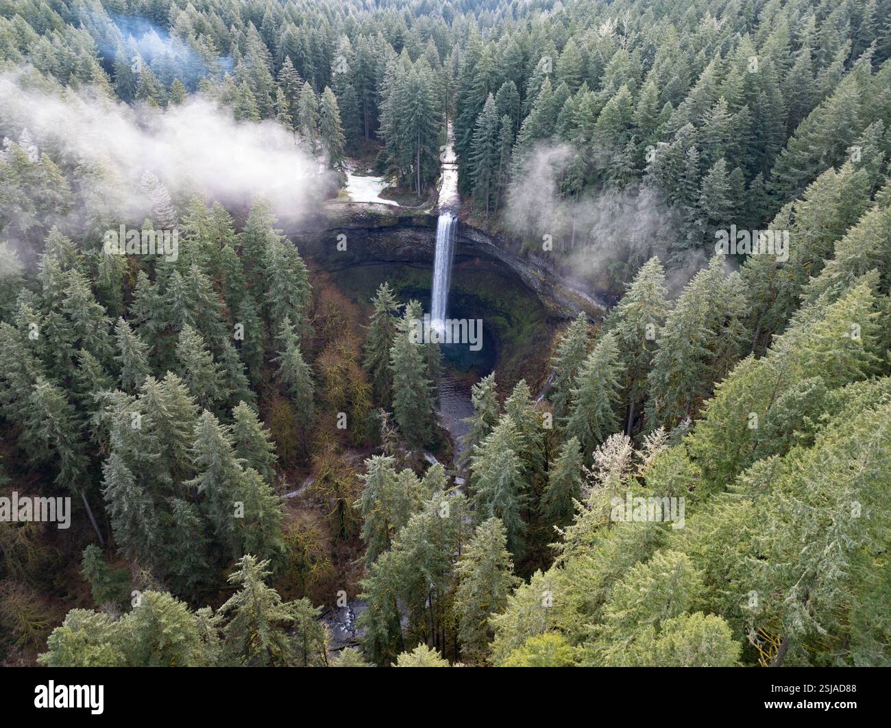 Wispy clouds drifts above the magnificent South Falls in Oregon. The ...
