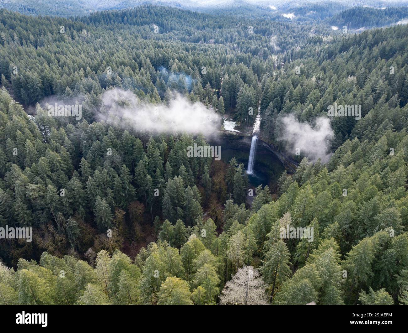 Wispy clouds drifts above the magnificent South Falls in Oregon. The ...