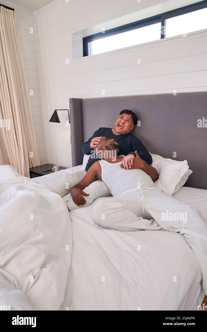 Gay couple in bed Stock Photo - Alamy