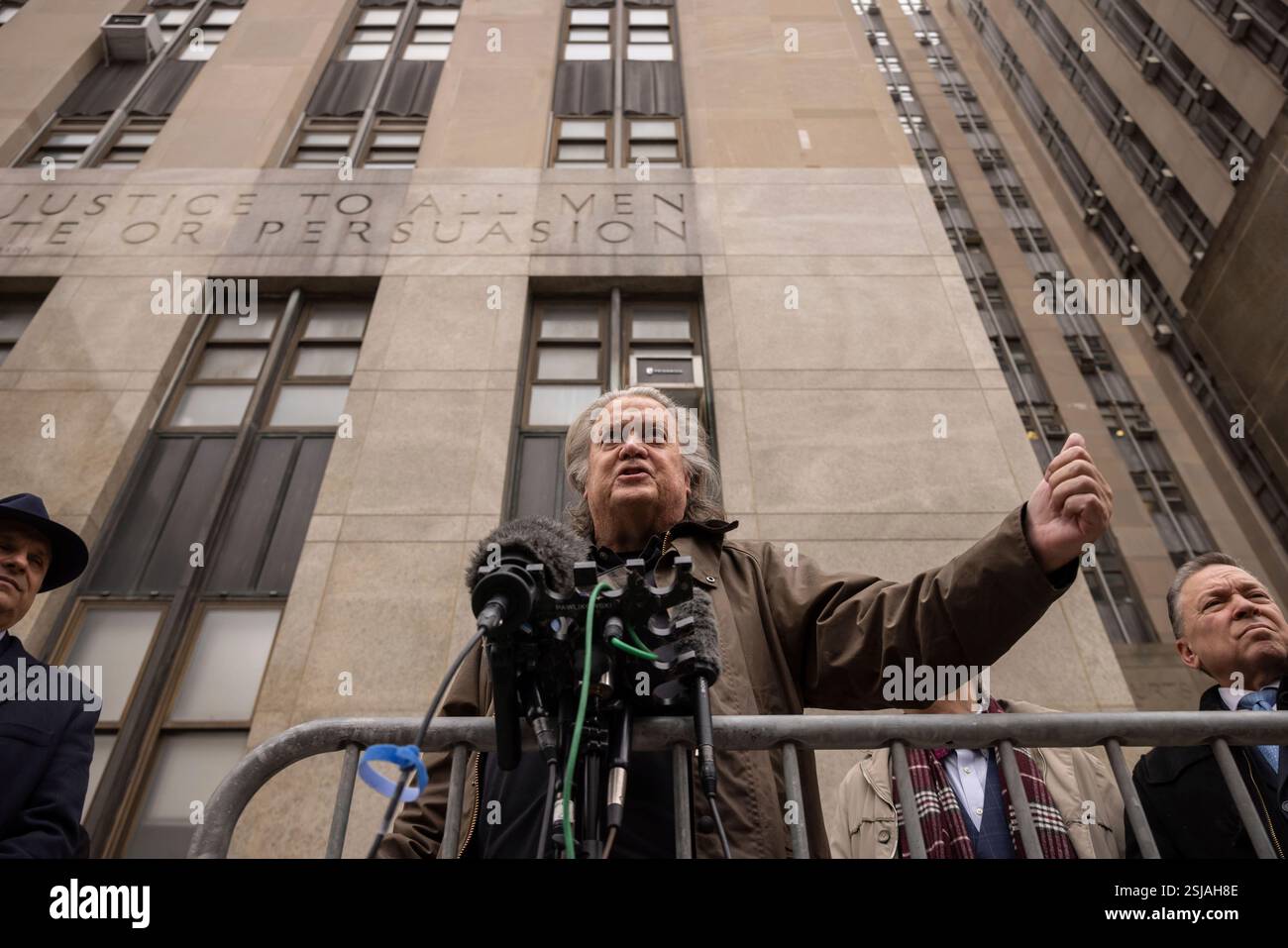 Steve Bannon speaks to reporters outside court in New York, Tuesday ...