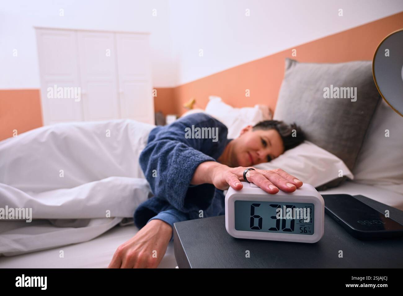 Sleeping man turning in bed hi-res stock photography and images - Alamy