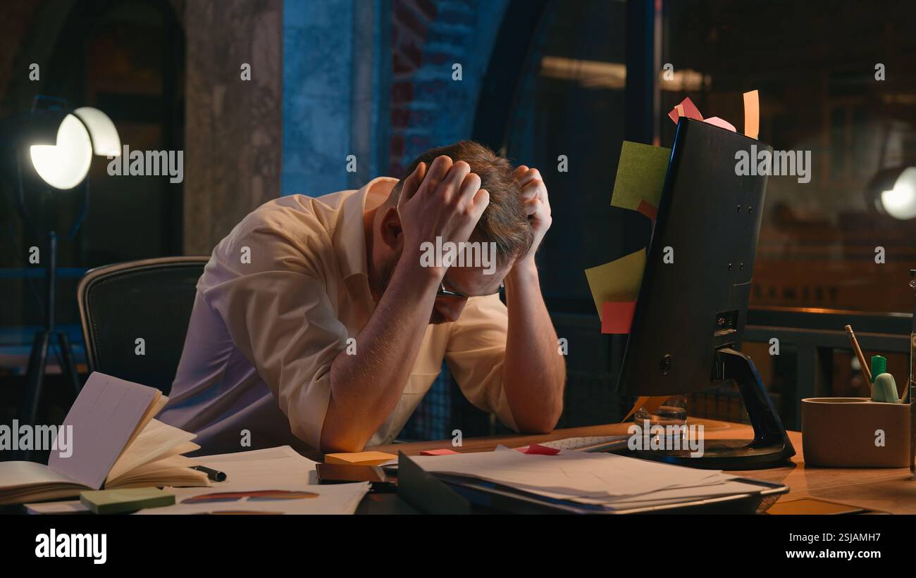 Tired stressed businessman looking monitor hi-res stock photography and ...