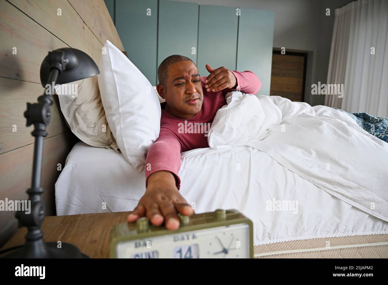 Man waking up in bedroom hi-res stock photography and images - Alamy