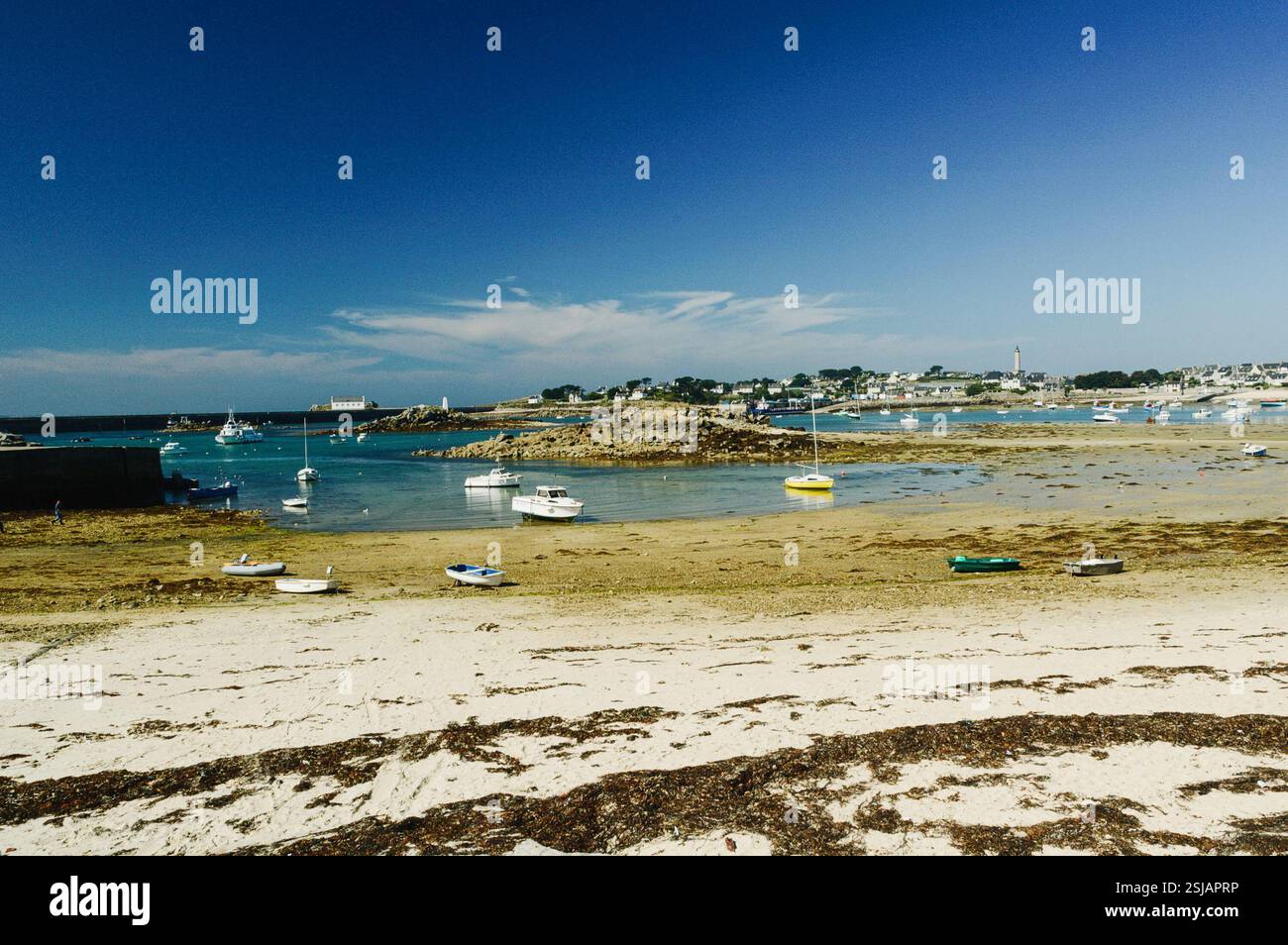 Boats moored in sheltered water on a summer’s day in Roscoff, France ...