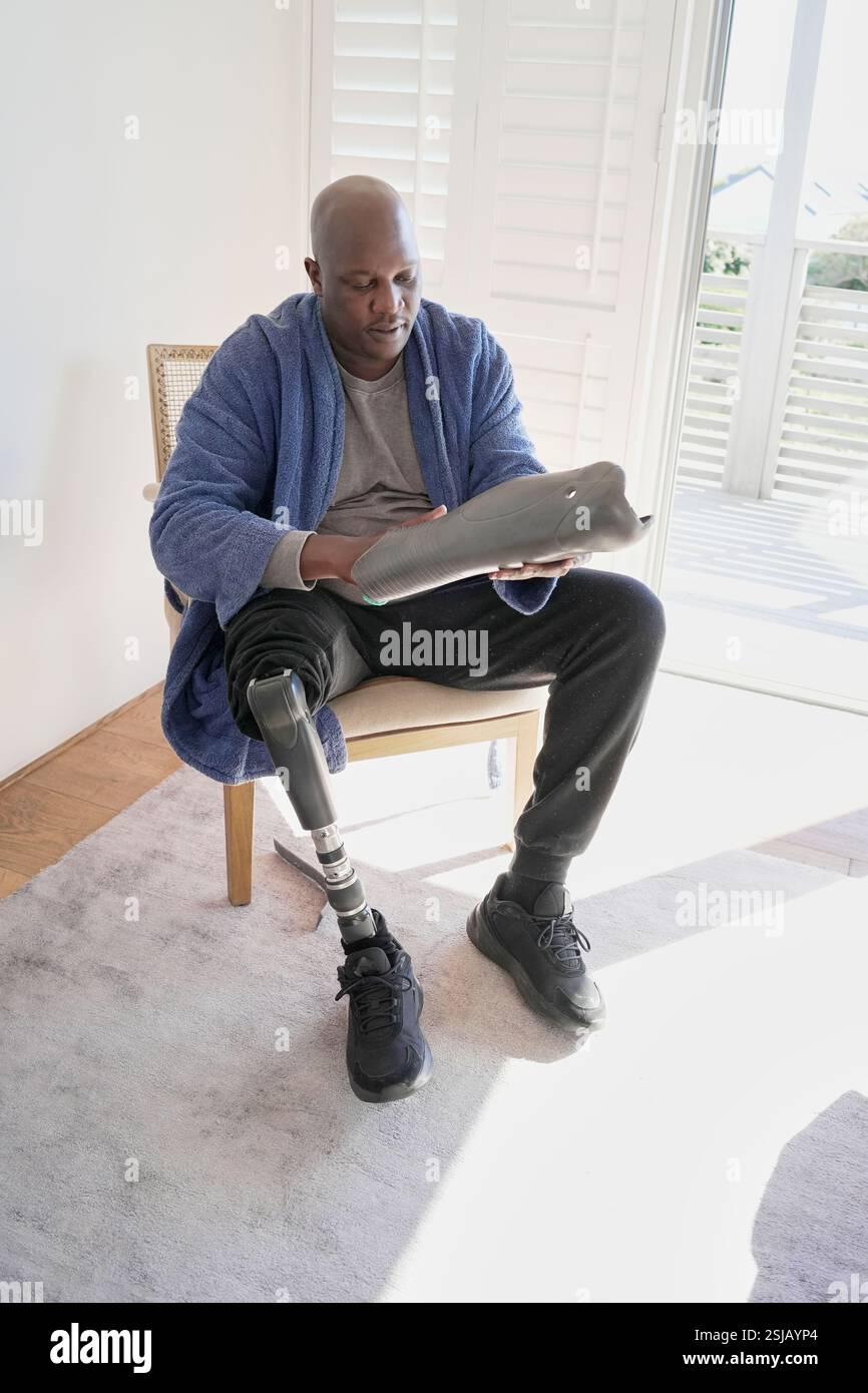 African man disability sitting hi-res stock photography and images - Alamy