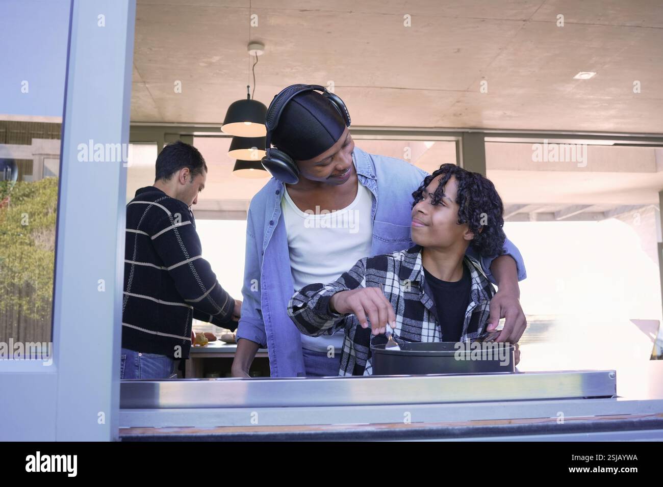 Brothers cooking together Stock Photo - Alamy