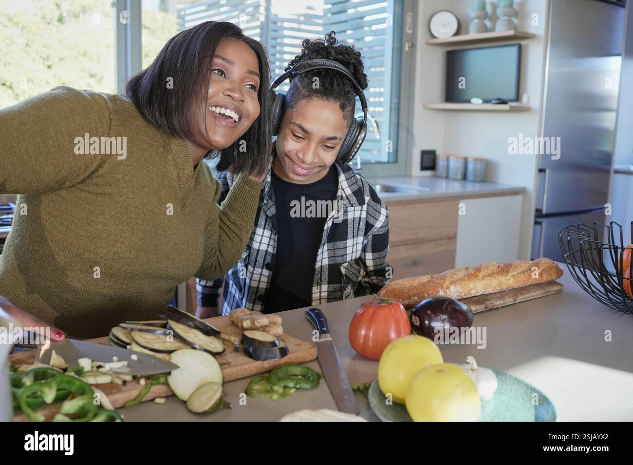 Sister and brother cooking together Stock Photo - Alamy