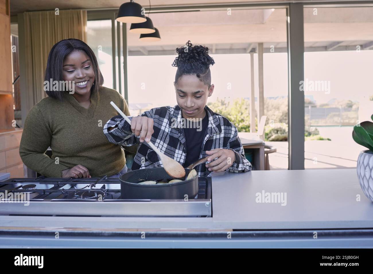 Sister and brother cooking together Stock Photo - Alamy