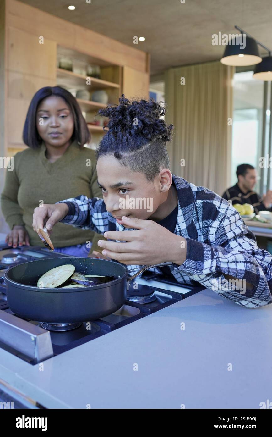 Sister and brother cooking together Stock Photo - Alamy
