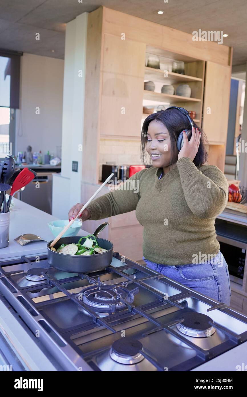 Woman cooking vegetables in kitchen Stock Photo - Alamy