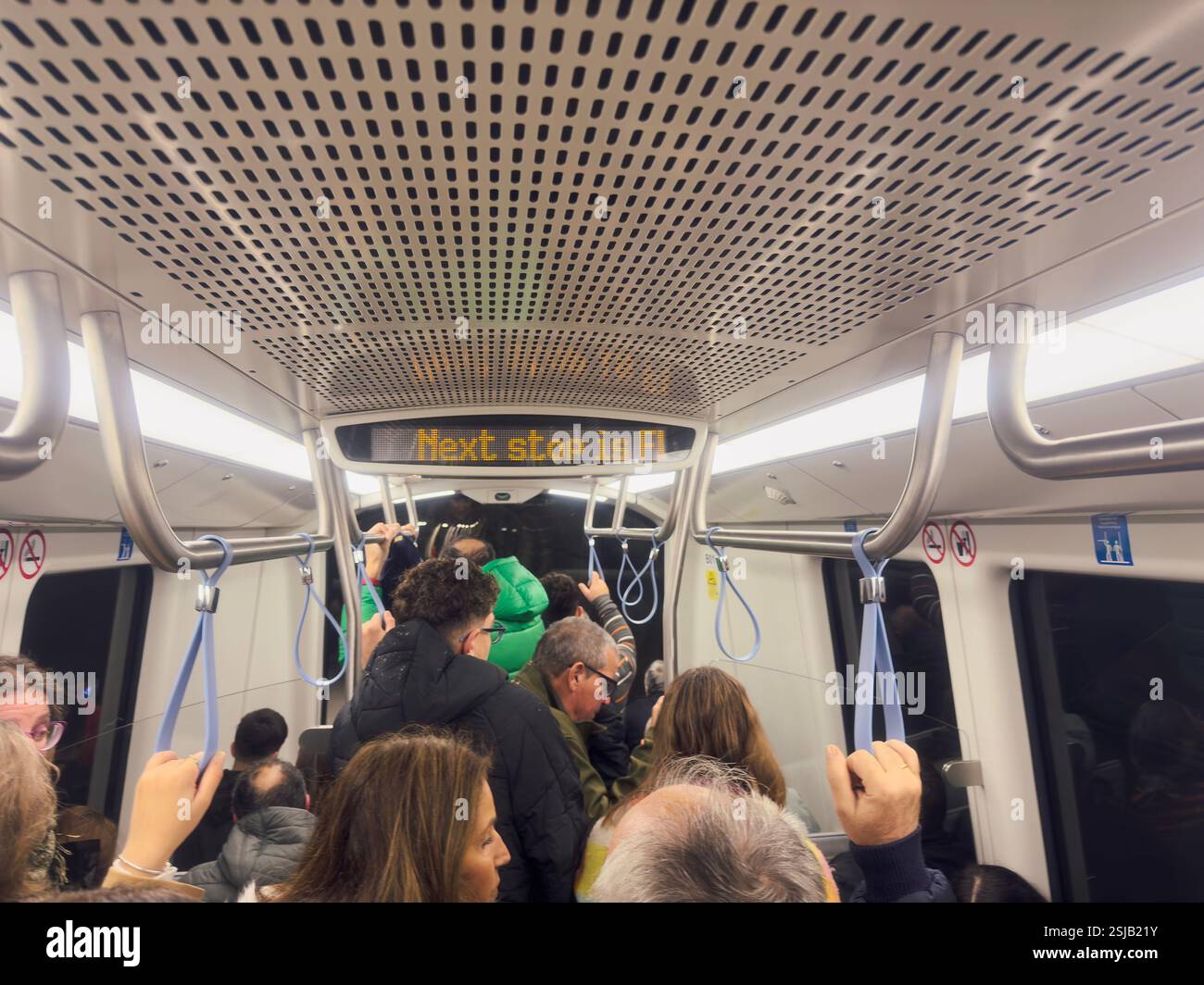 Thessaloniki, Greece subway train moves along its route with many ...