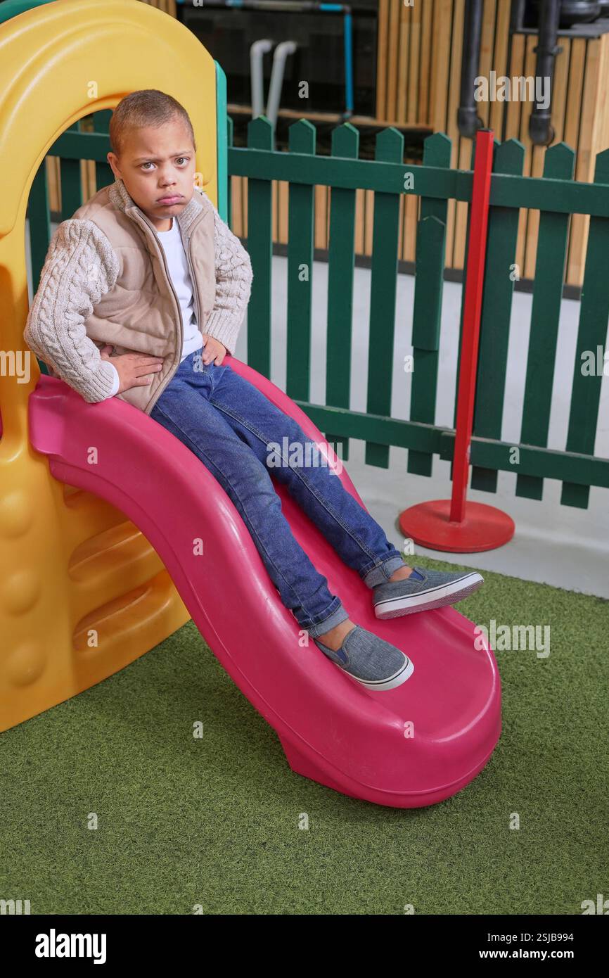 Boy disability sitting in hi-res stock photography and images - Alamy