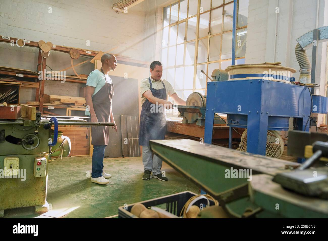 Visually impaired men in wood shop Stock Photo - Alamy