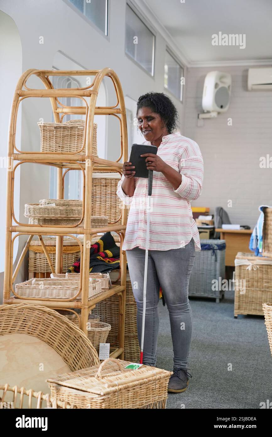Visually impaired woman in store Stock Photo - Alamy