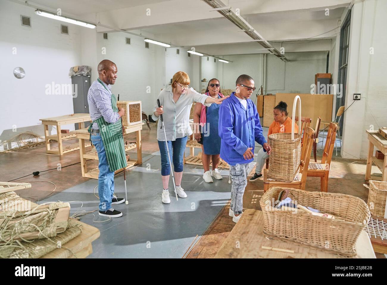 Visually impaired people weaving wicker Stock Photo - Alamy