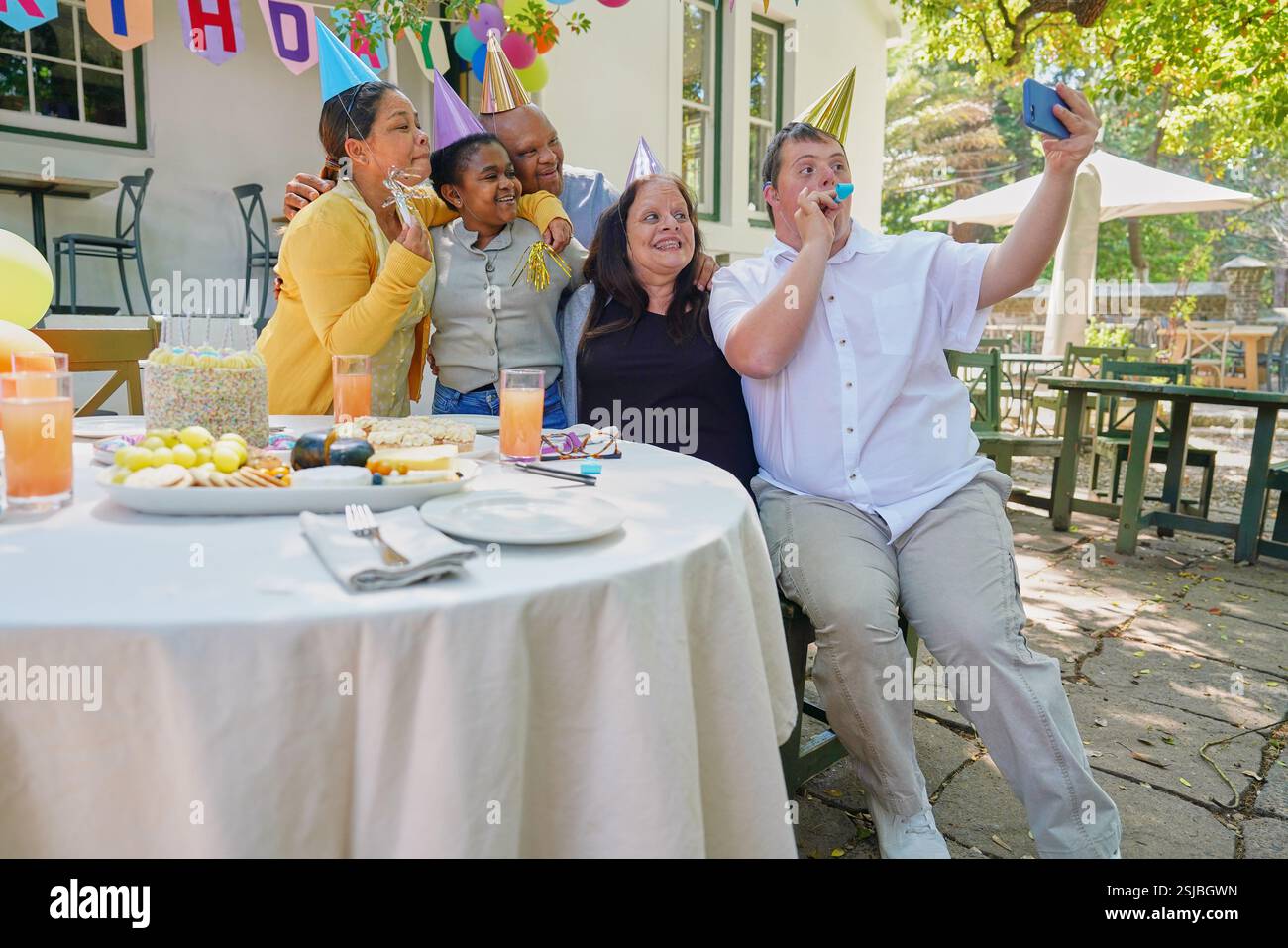 Disabled friends celebrating birthday Stock Photo - Alamy