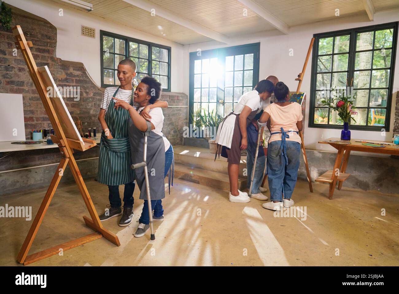 Disabled people talking in art studio Stock Photo - Alamy