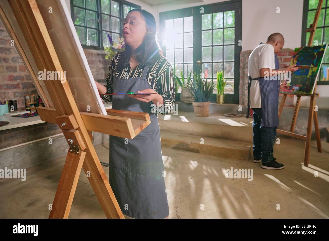 Disabled people painting during art class Stock Photo - Alamy